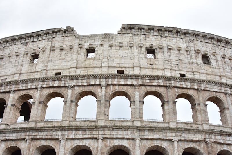 The ancient Colosseum in Rome showing its iconic arched exterior