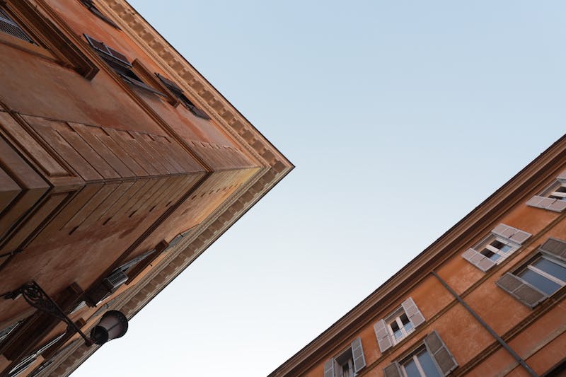 Historic Roman buildings with classic architecture against a clear sky