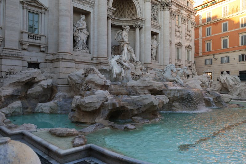 Trevi Fountain in Rome with turquoise water and baroque sculptures