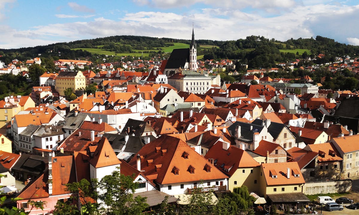 Close-up aerial view of Cesky Krumlov rooftops showing the dense medieval architecture