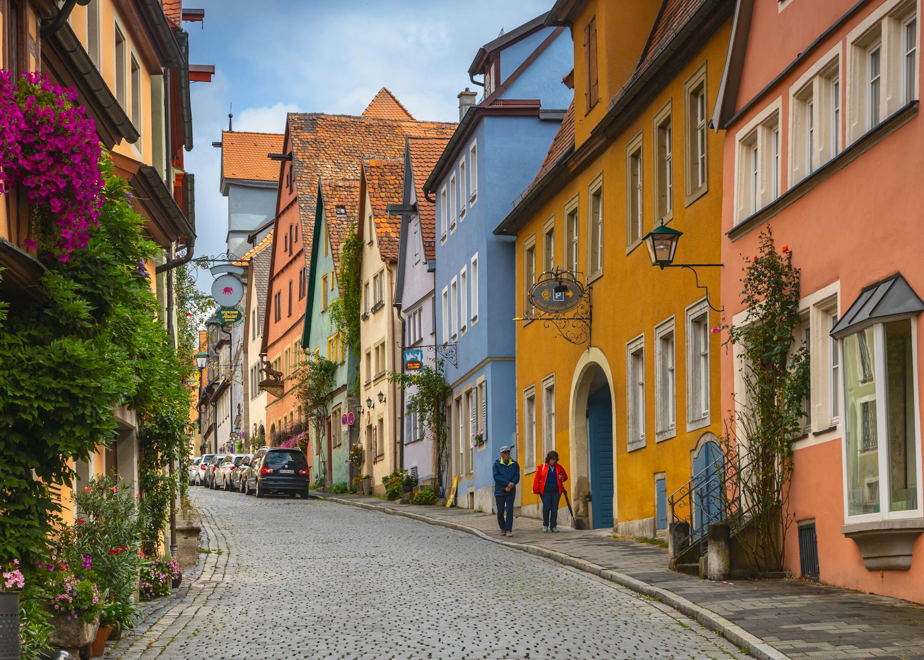Colorful historic buildings on a cobblestoned street in Rothenburg