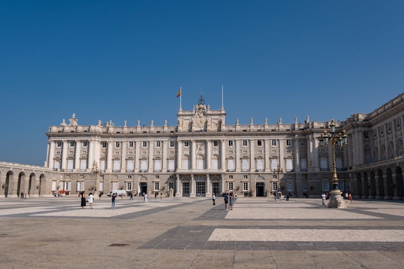 The Royal Palace of Madrid showing its full grand facade under blue sky