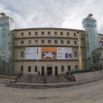 The exterior facade of the Museo Reina Sofia in Madrid with its distinctive glass elevators
