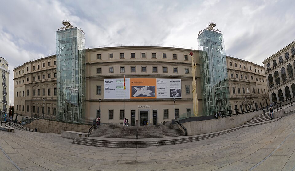 The exterior facade of the Museo Reina Sofia in Madrid with its distinctive glass elevators