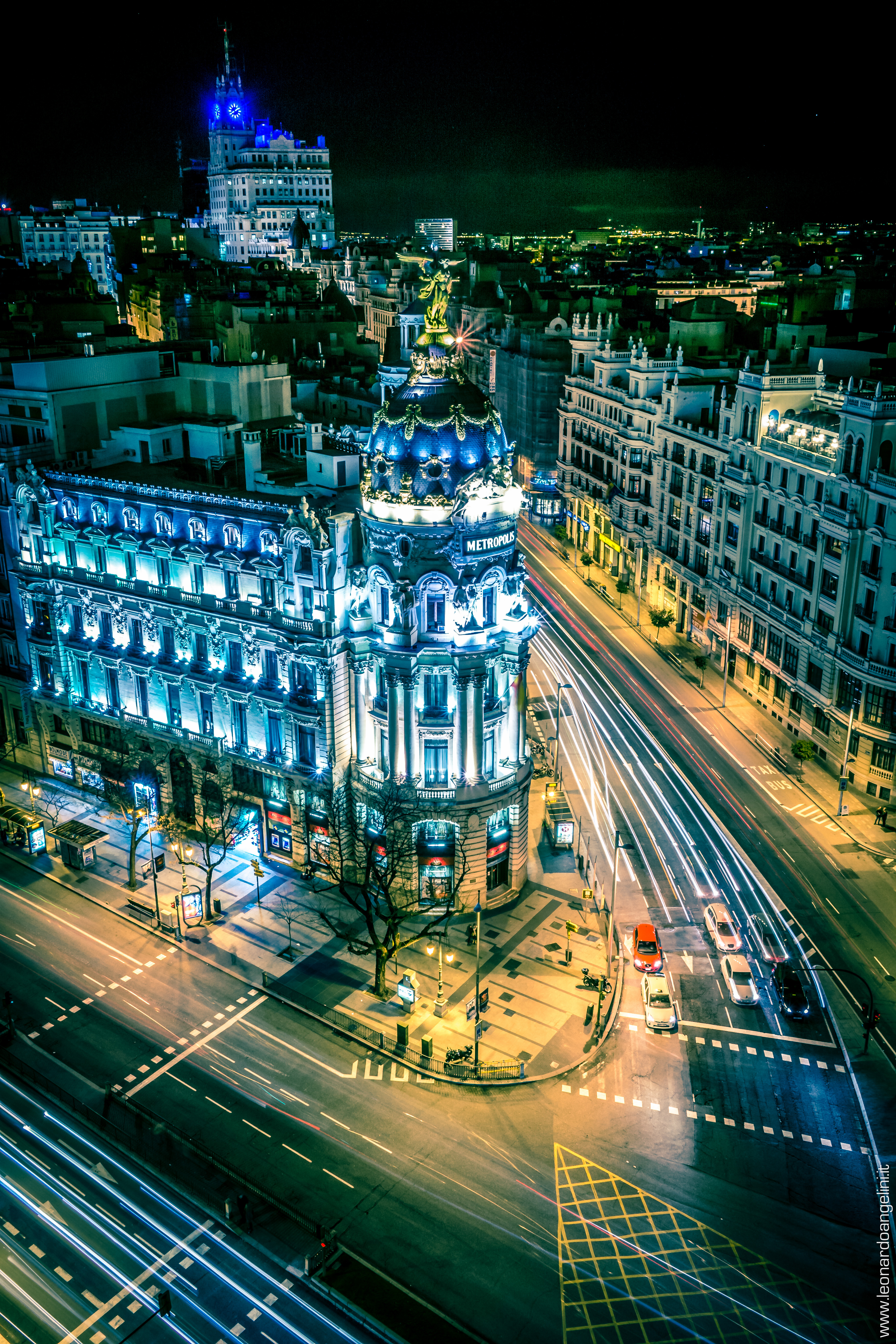 The Gran Via boulevard in Madrid illuminated at night with historic buildings and city lights