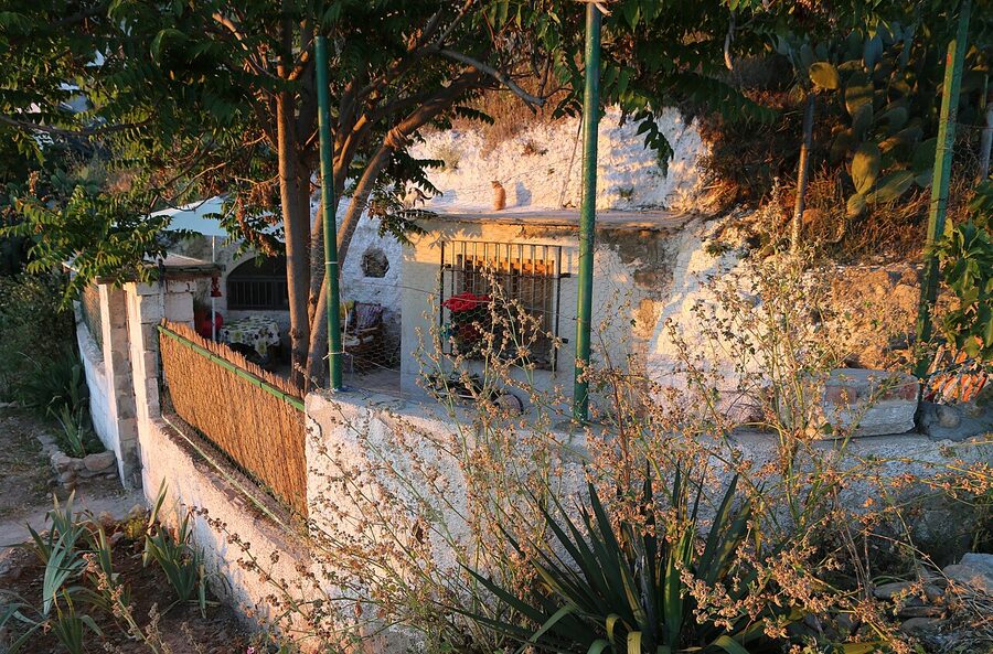 A traditional cave house on the hills of Sacromonte in Granada Spain with white facade