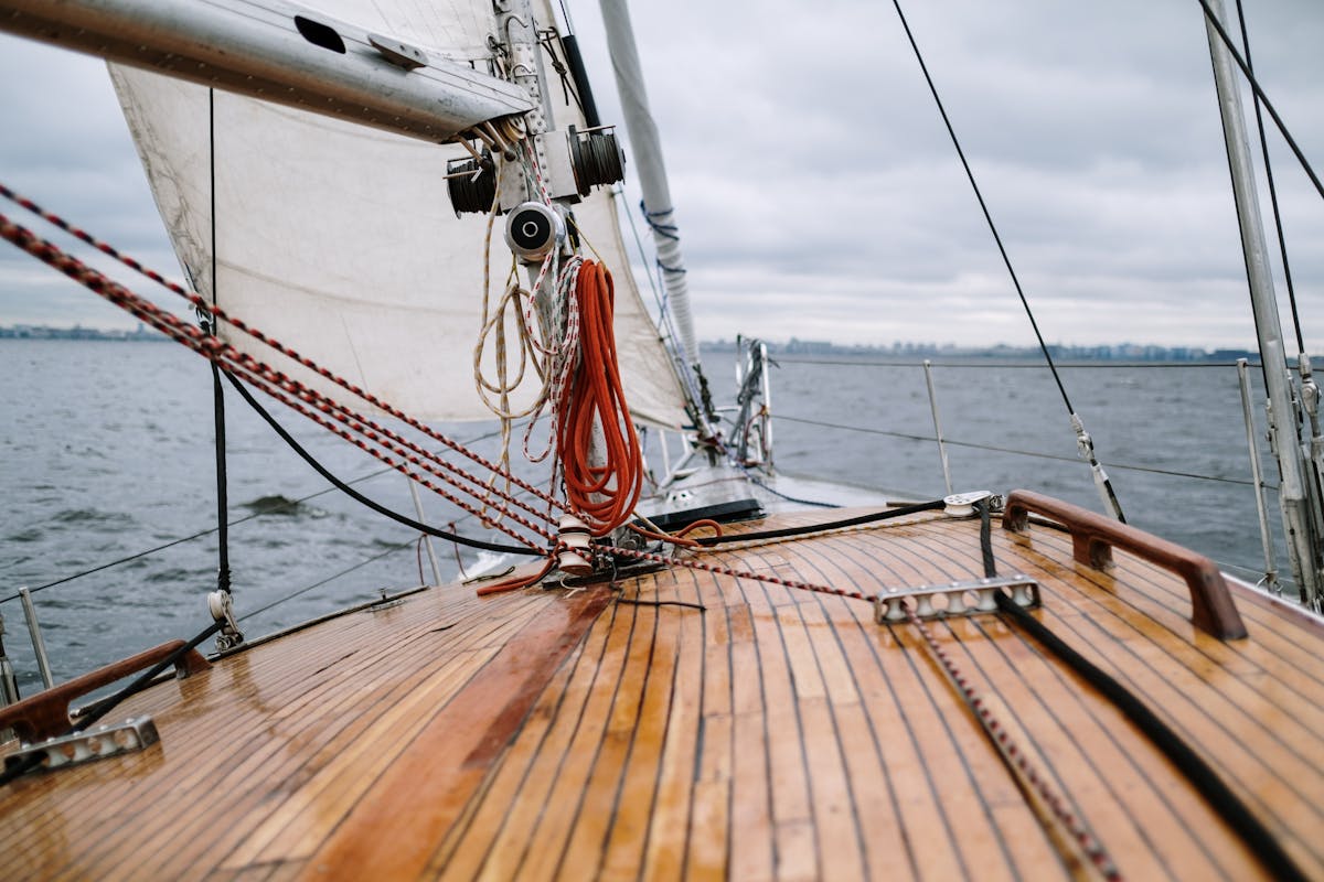 Wooden deck of a sailboat navigating the open ocean