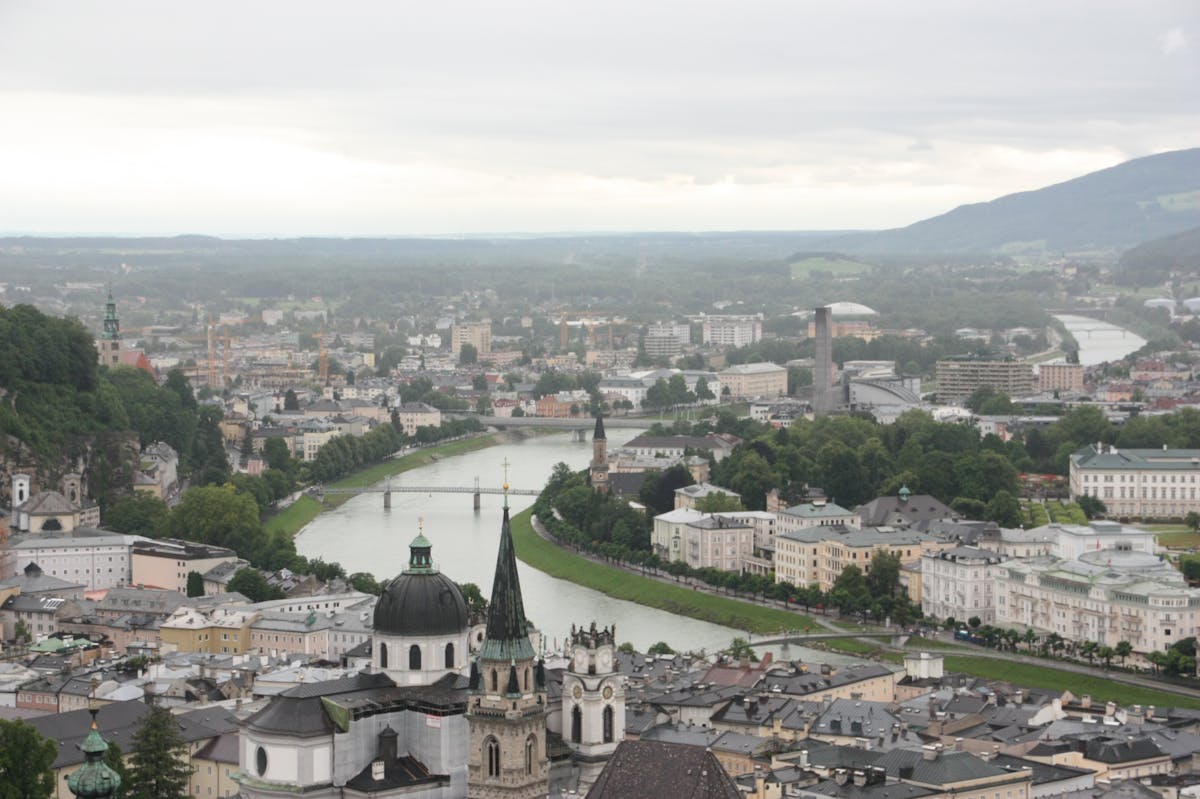 Aerial view of Salzburg with churches and Salzach River