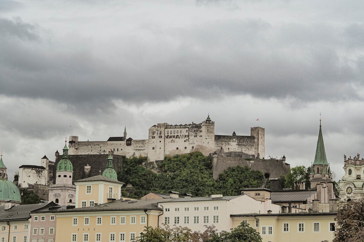 Colorful historic buildings in Salzburg with Hohensalzburg Fortress