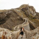 Aerial view of San Juan de Gaztelugatxe islet connected by stone bridge to mainland in Basque Country Spain