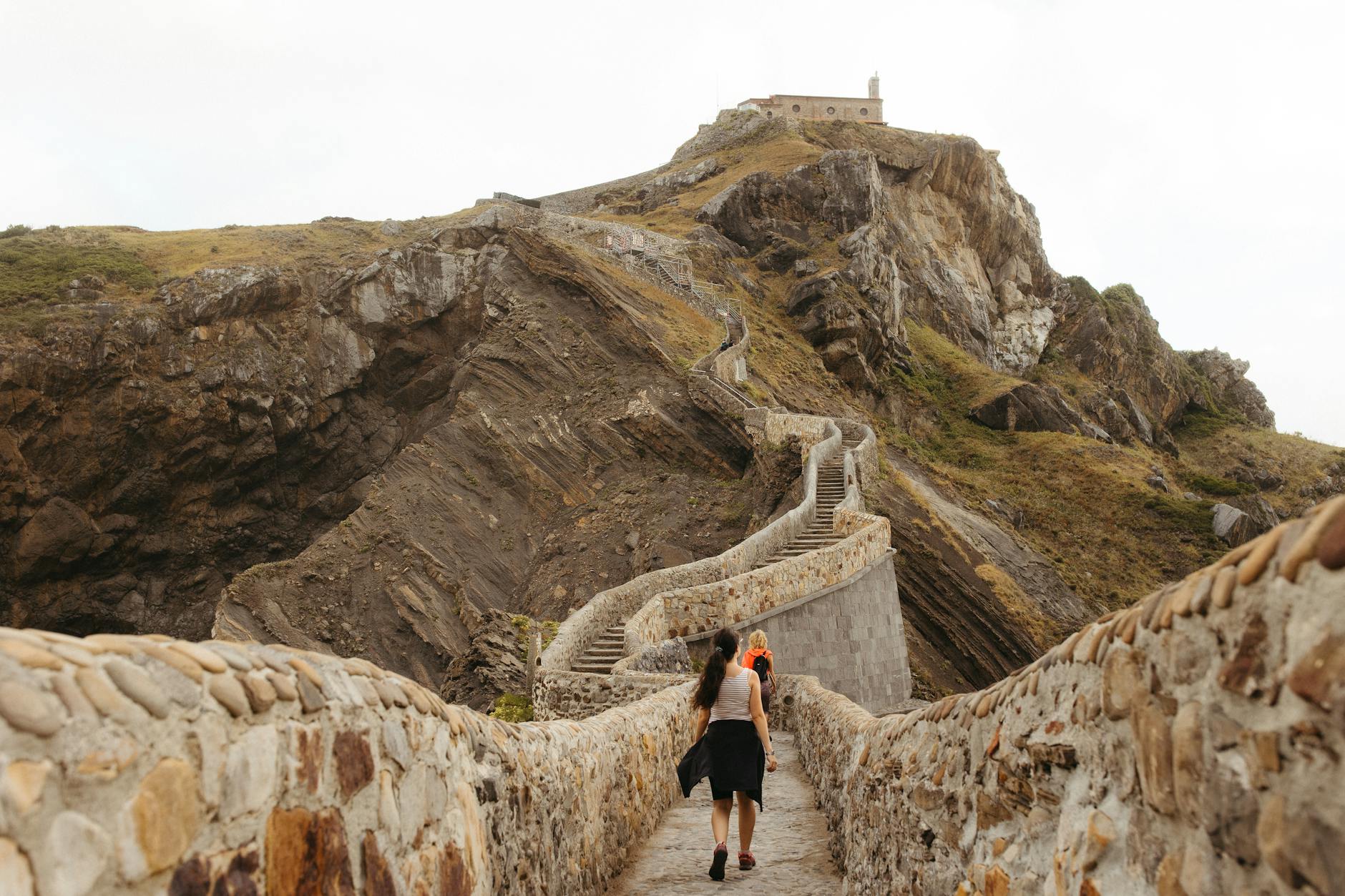 Aerial view of San Juan de Gaztelugatxe islet connected by stone bridge to mainland in Basque Country Spain