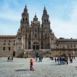 Santiago de Compostela Cathedral facade with visitors in the plaza