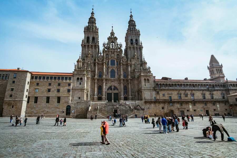 Santiago de Compostela Cathedral facade with visitors in the plaza