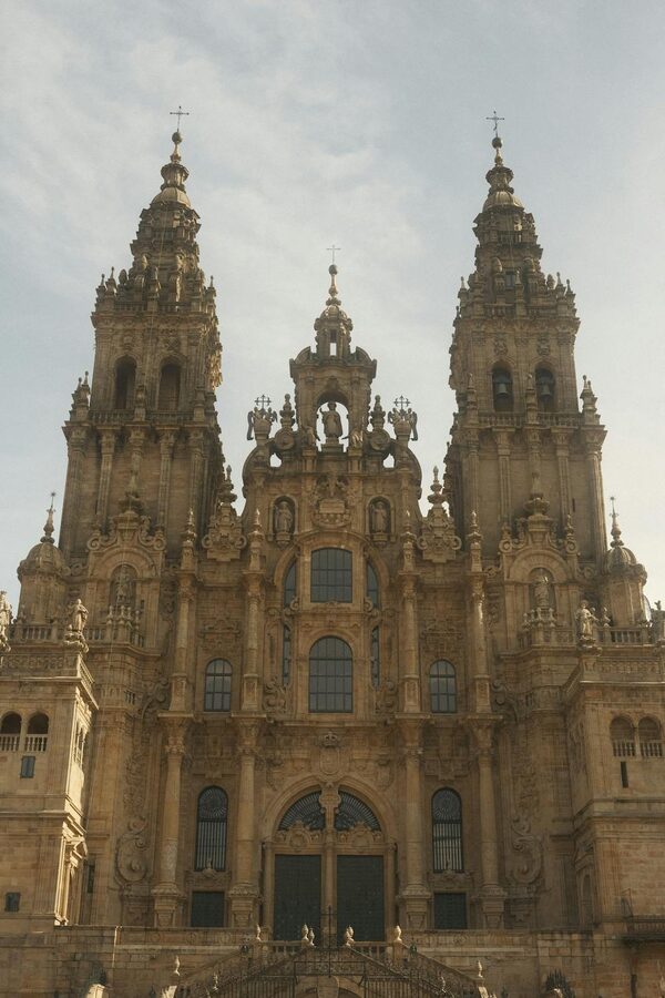 Visitor exploring the Santiago de Compostela Cathedral during summer