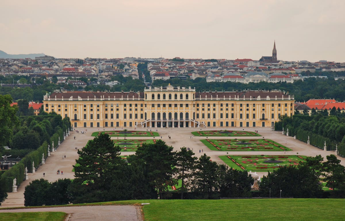Aerial view of Schonbrunn Palace with manicured gardens in Vienna