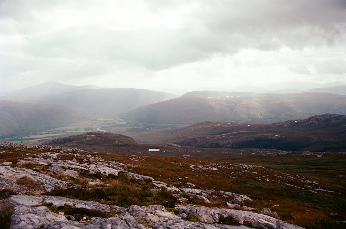 The rugged terrain of the Scottish Highlands stretching into the distance