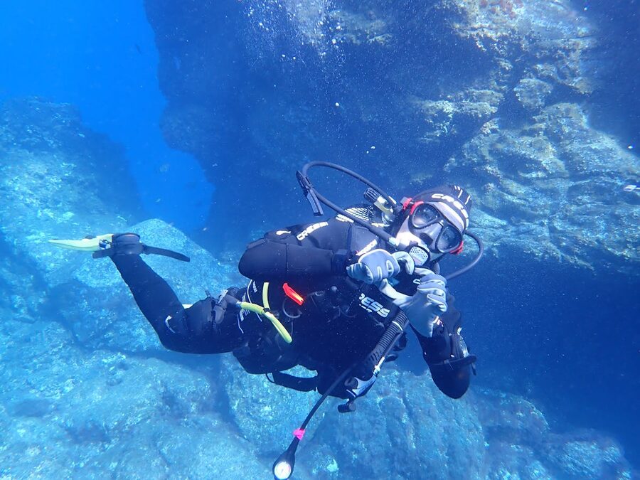 Scuba diver exploring underwater landscape in the Mediterranean Sea off the Spanish coast