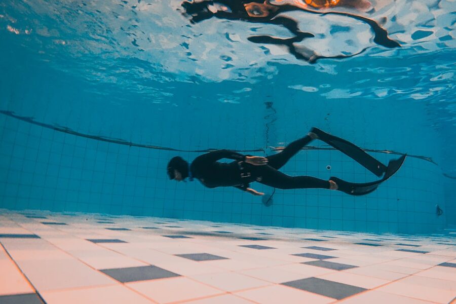 Scuba diver practicing skills during a pool training session
