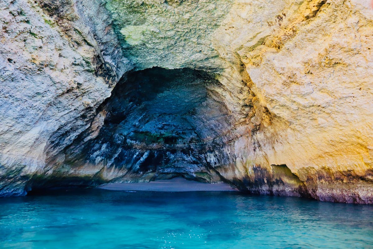 Beautiful sea cave with sparkling blue waters in Carvoeiro, Algarve, Portugal