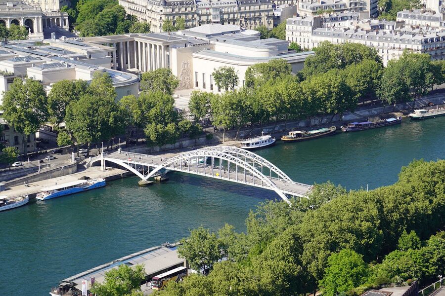 Aerial view of the Seine River and bridge highlighting Parisian city architecture