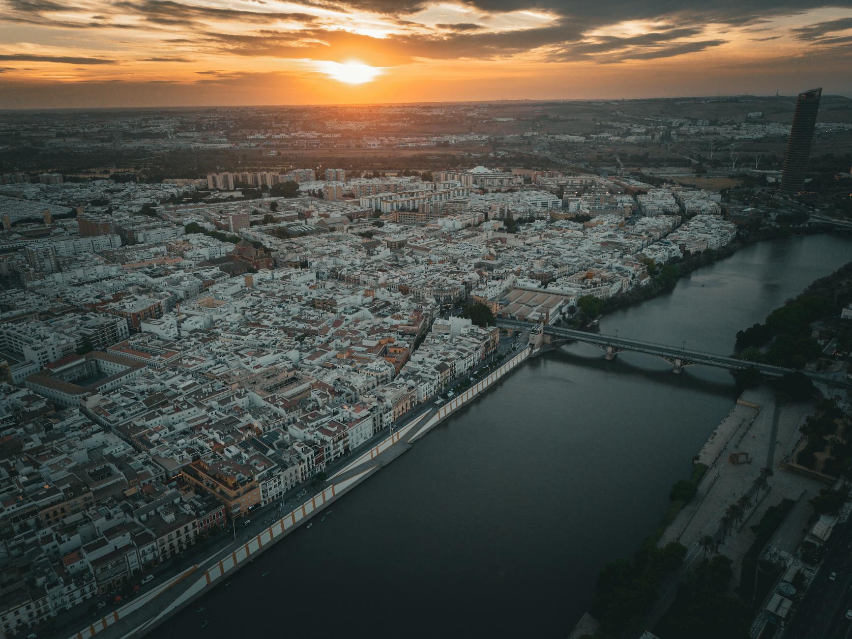 Aerial view of Seville at sunset with Guadalquivir River