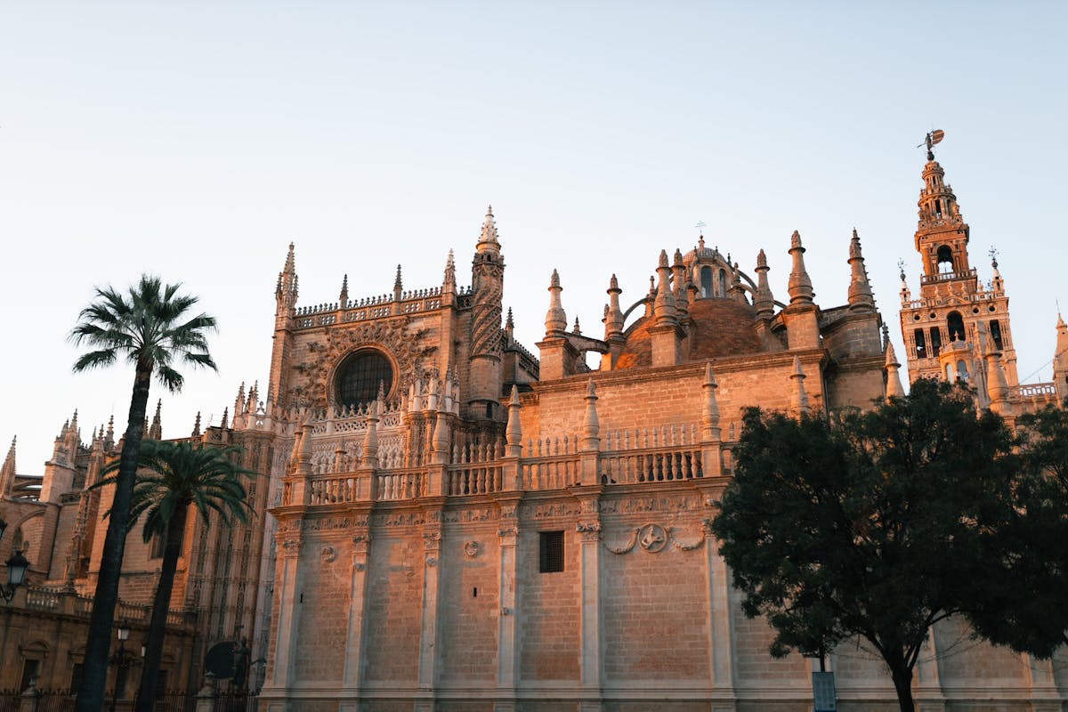 Seville Cathedral illuminated by warm evening light showing Gothic architecture