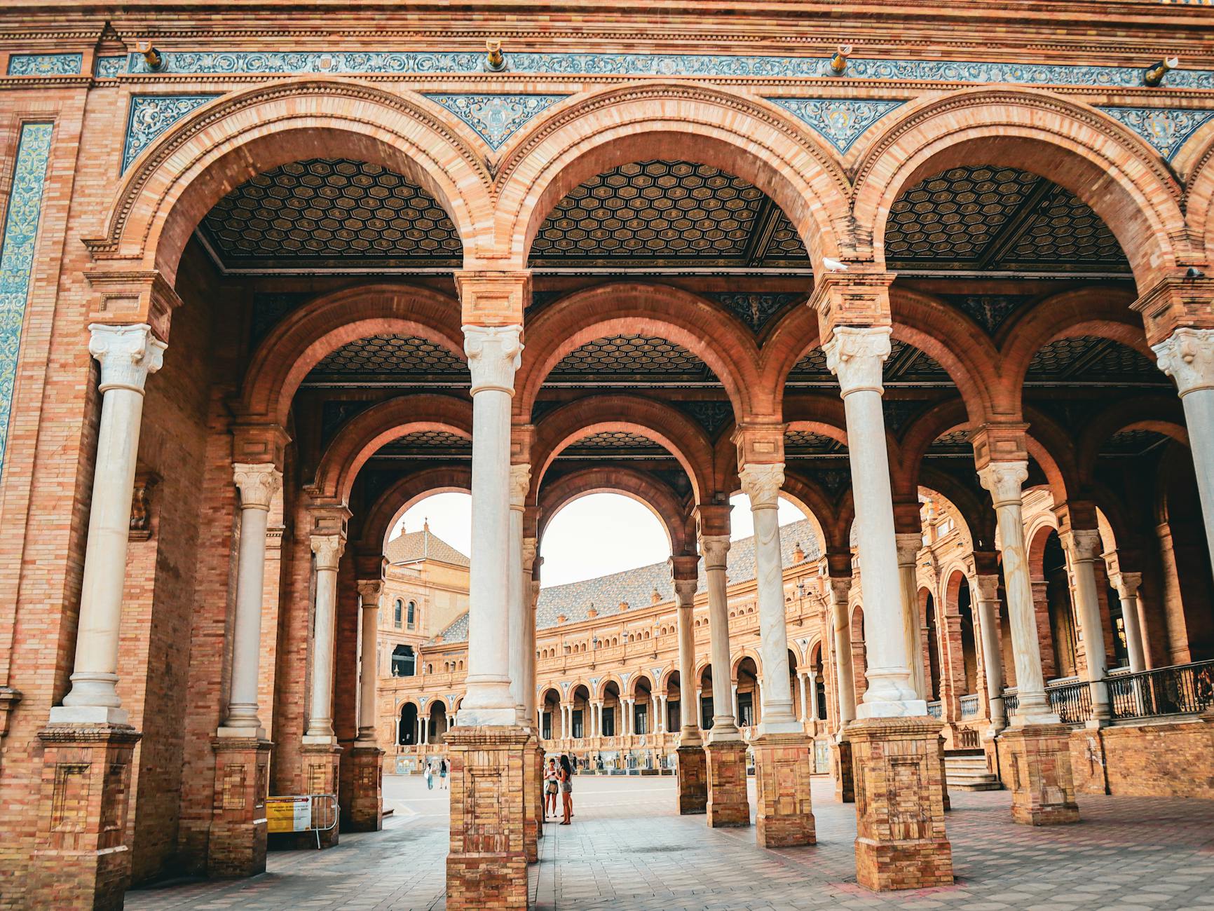 Red brick arches and columns at Plaza de Espana in Seville