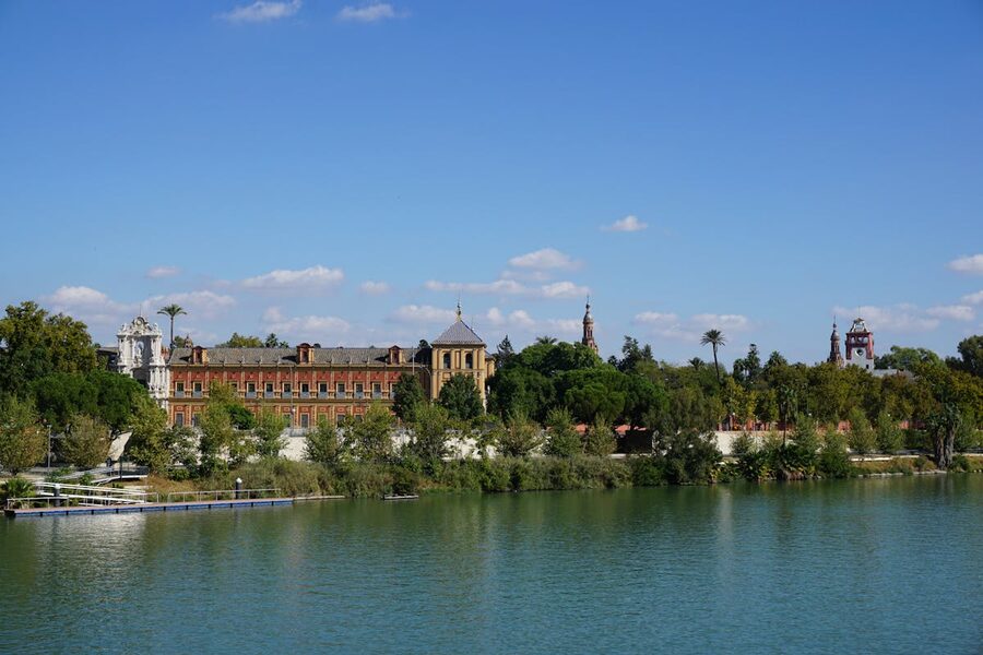 Row of historic buildings along the Guadalquivir riverbank in Seville Spain