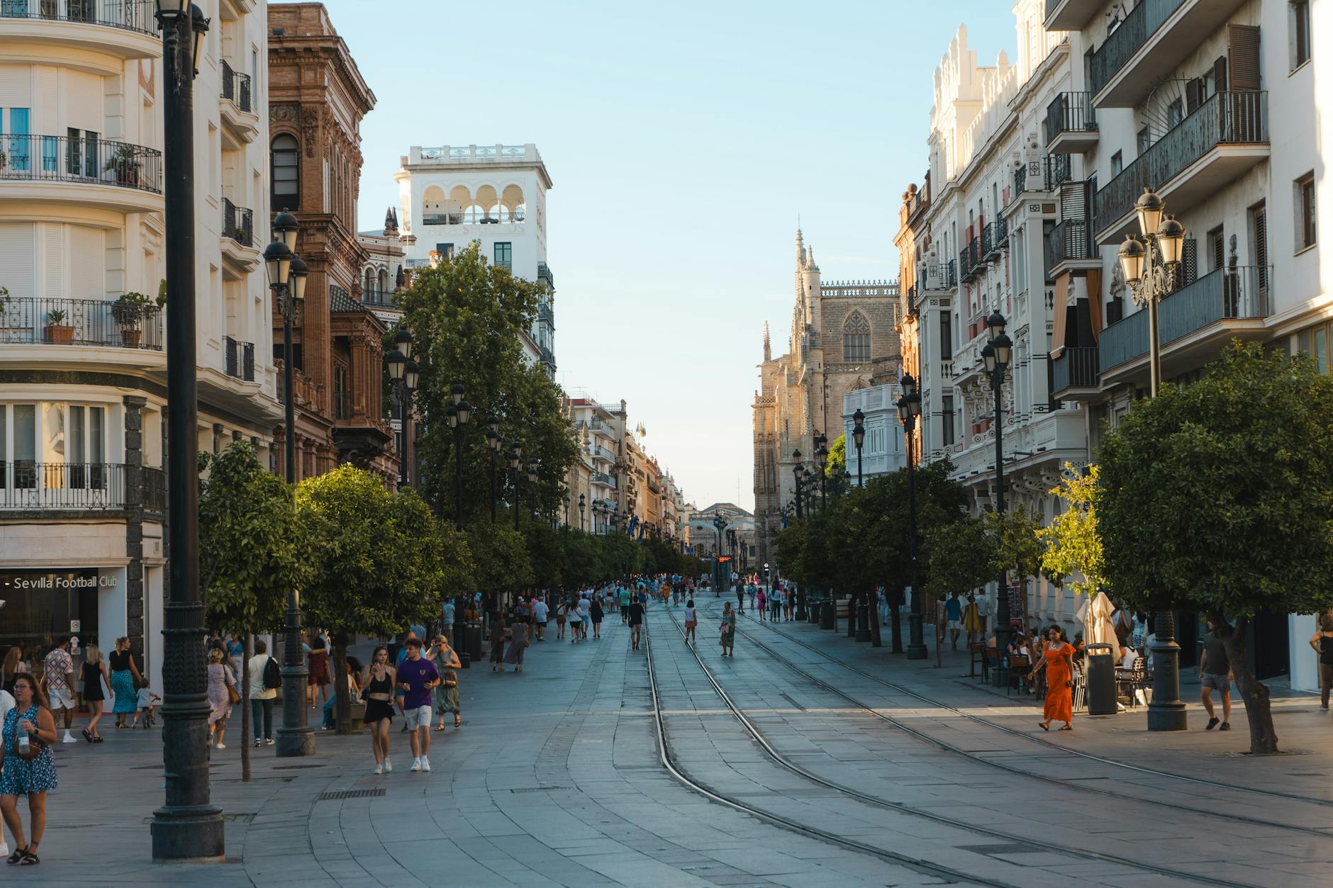 Street scene in Seville with historic architecture and pedestrians