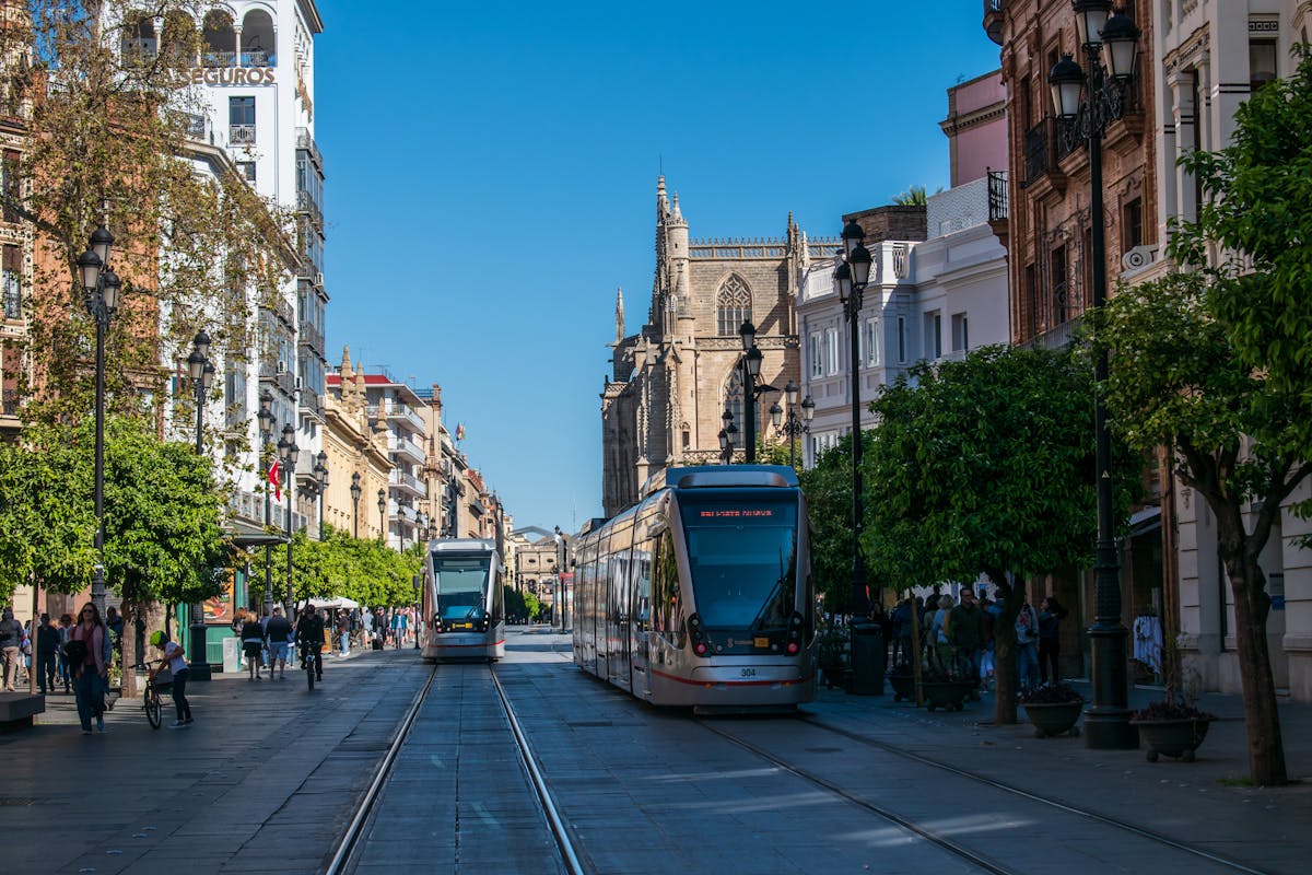 Tram running along Avenida de la Constitucion in Seville near the Cathedral