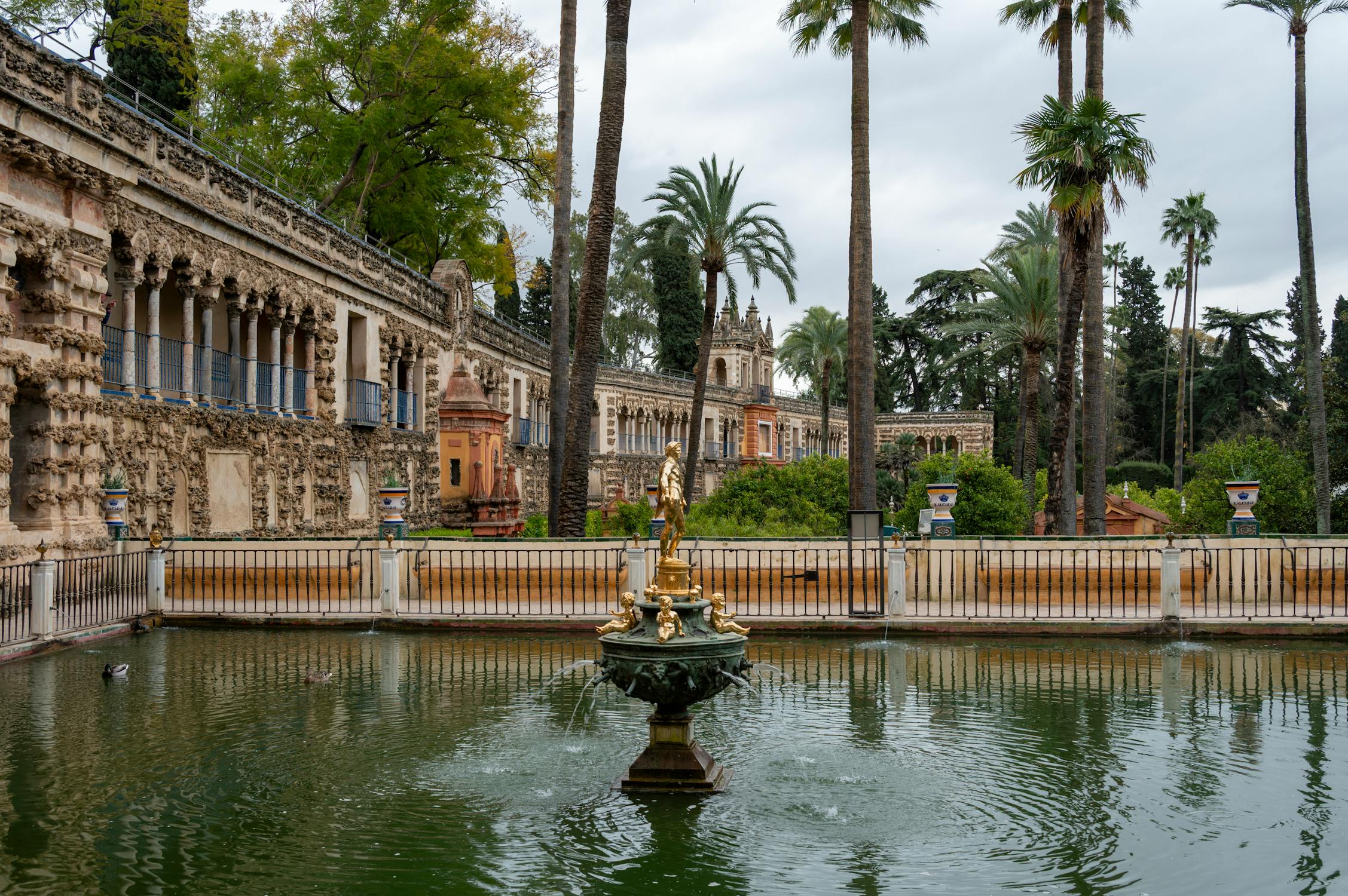 Detailed Moorish arches and tilework inside the Alcazar of Seville