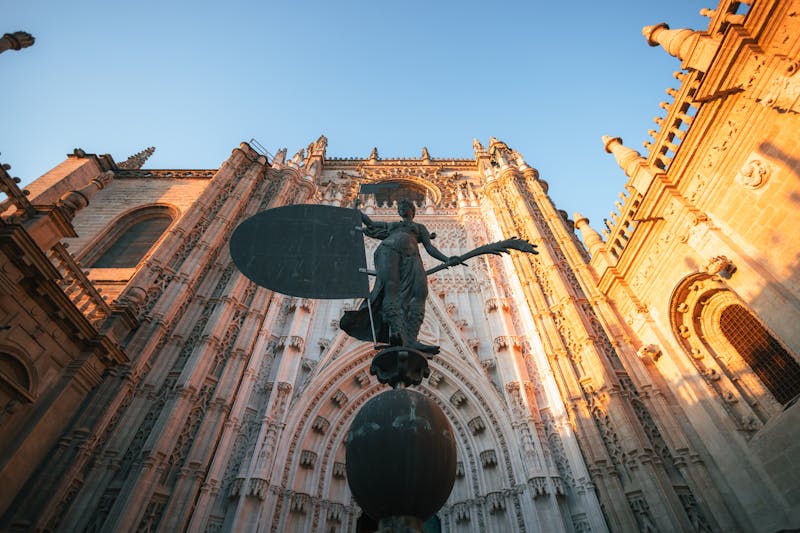Majestic Seville Cathedral illuminated by warm sunset light