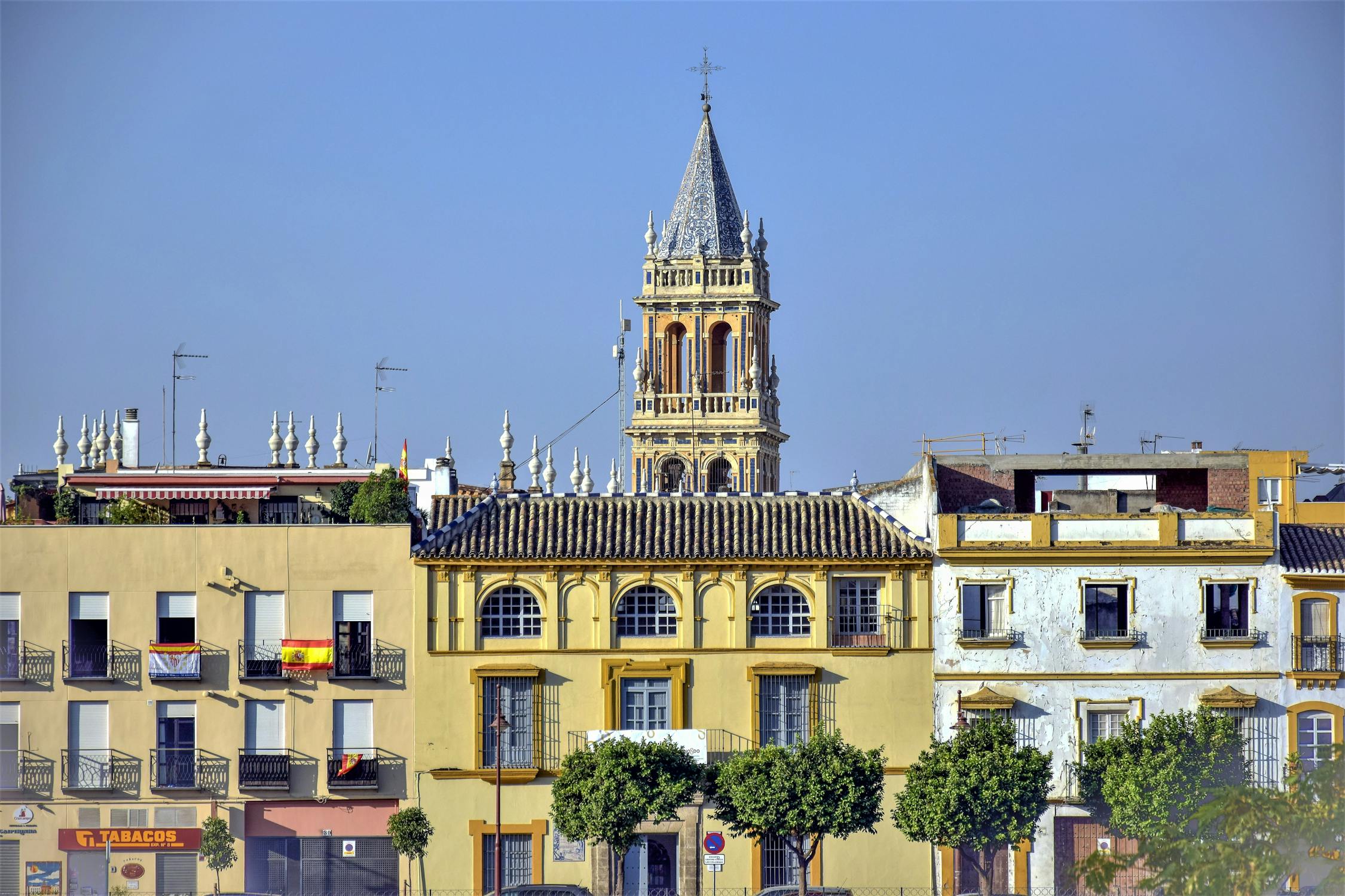 La Giralda bell tower of Seville Cathedral rising above traditional Spanish buildings