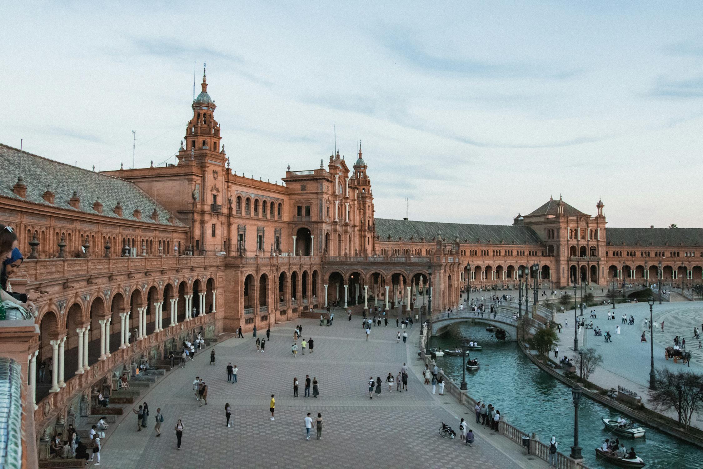 The semicircular Plaza de Espana in Seville with its ornate bridges and ceramic tile alcoves