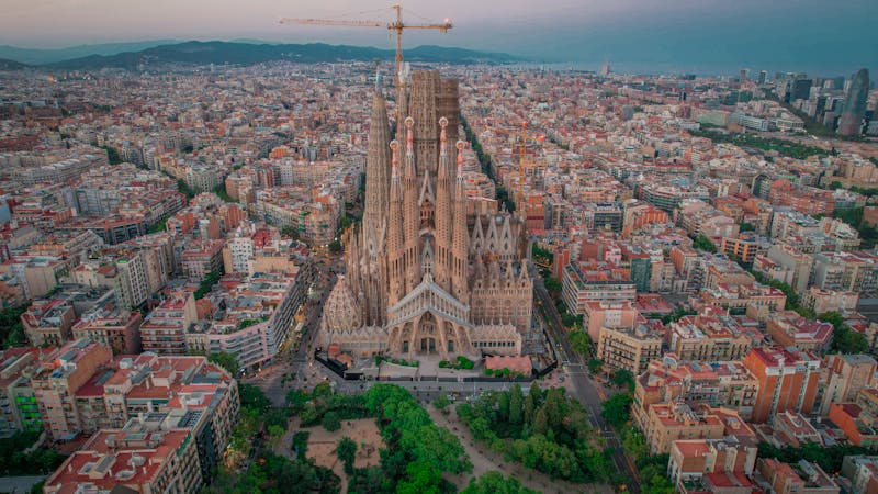 Aerial photograph showing Sagrada Familia rising above the Barcelona city grid
