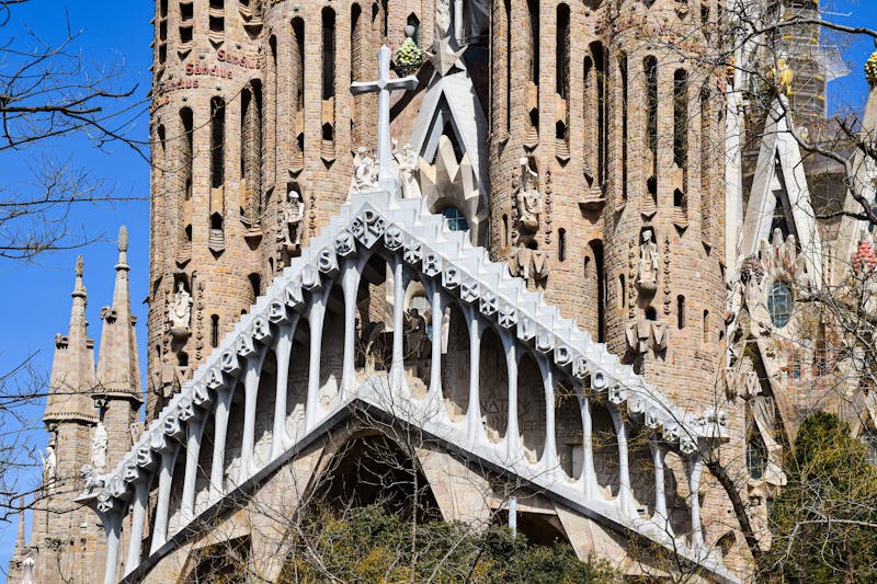 Detailed view of carved stone figures and Gothic elements on the Sagrada Familia facade