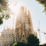 The Sagrada Familia basilica in Barcelona with its towering spires under bright sunlight