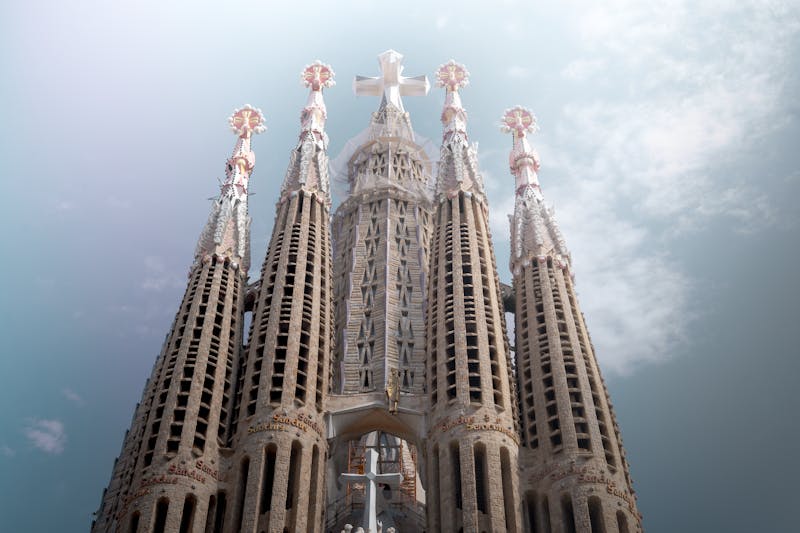 Close-up of Sagrada Familia tower showing intricate stone carvings and geometric patterns