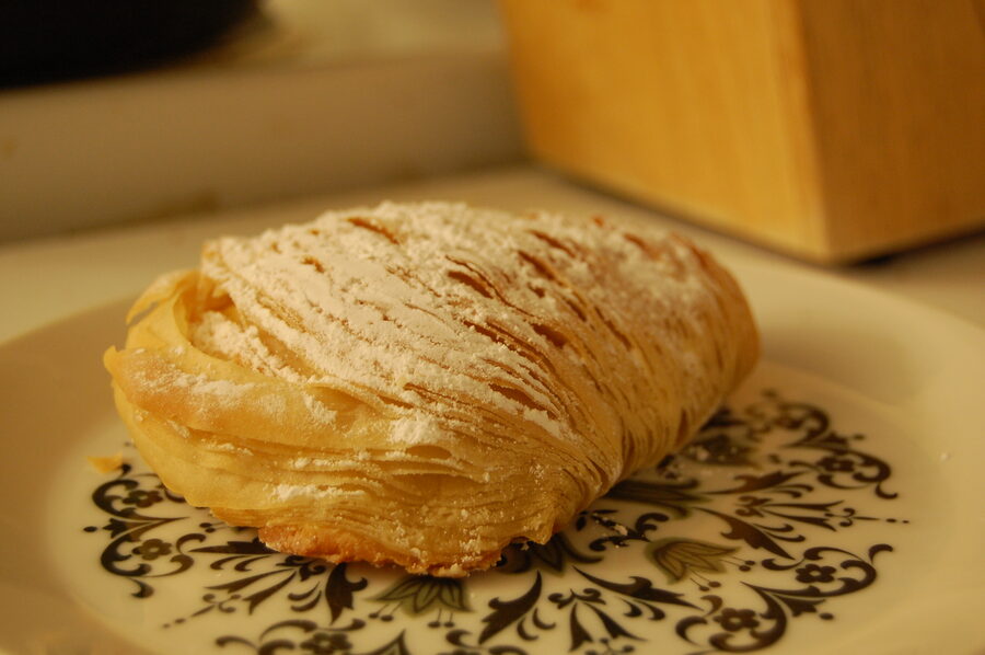 Traditional sfogliatella pastry from Naples showing flaky layered texture