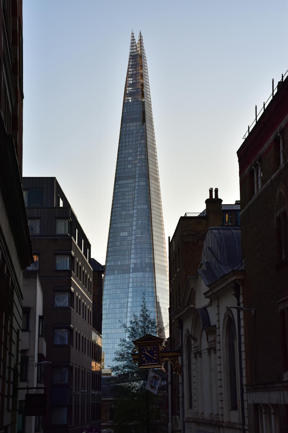 Dramatic view of The Shard against clouds