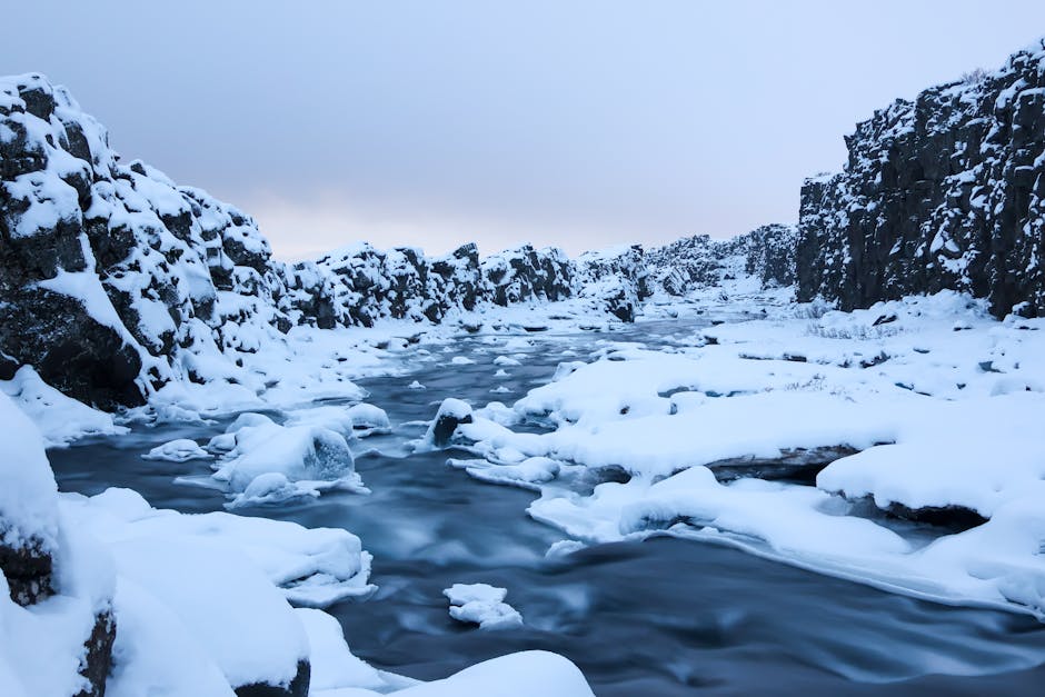 Person snorkeling in crystal clear Silfra water Iceland