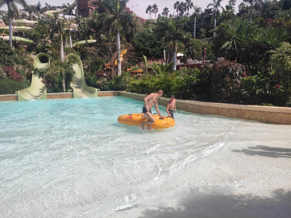 Thai temple-style buildings and swimming pools at Siam Park