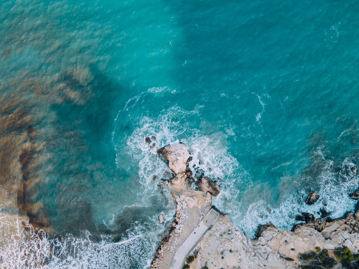 Aerial view of the rocky coastline and turquoise Mediterranean waters near Alicante Spain