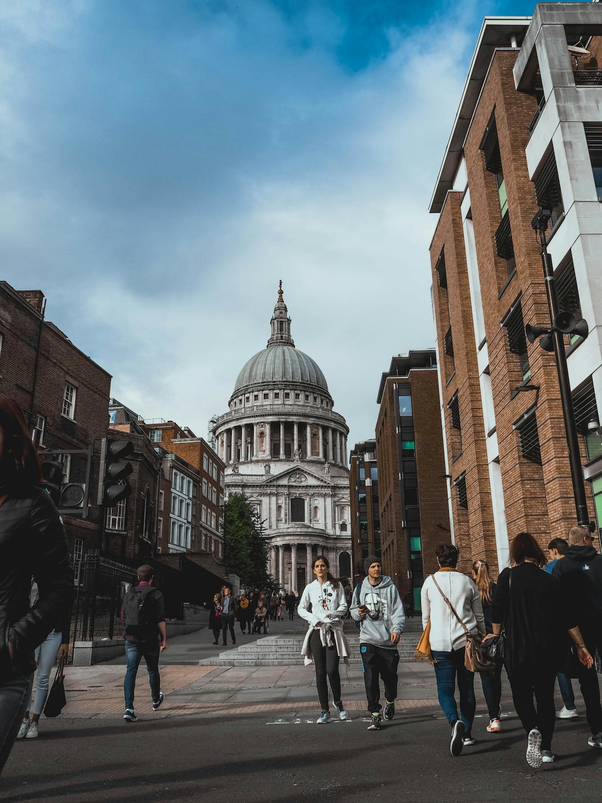 People walking on a busy street near St Paul's Cathedral