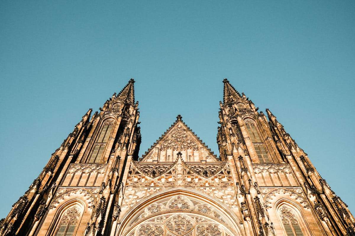 The Gothic facade of St Vitus Cathedral in Prague Castle under a clear sky