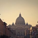 St Peters Basilica and square viewed from Via della Conciliazione at dusk with the dome illuminated