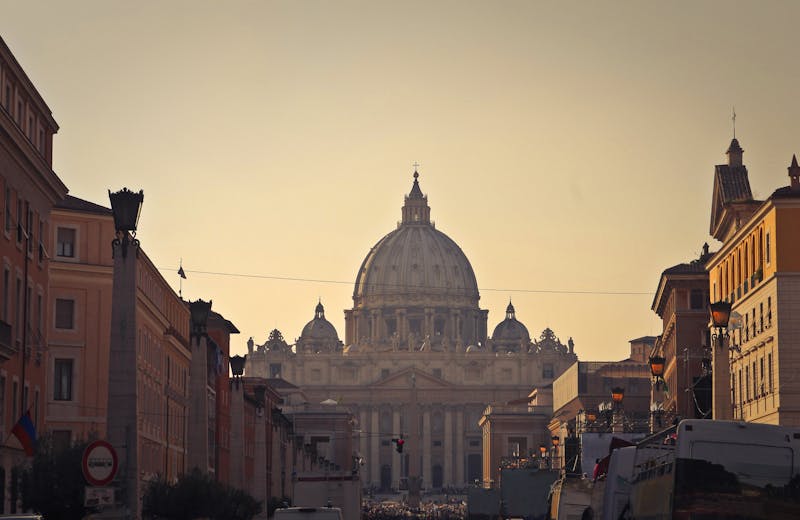 St Peters Basilica and square viewed from Via della Conciliazione at dusk with the dome illuminated