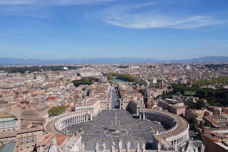 Aerial view of St Peters Square in Vatican City showing the elliptical colonnade and obelisk