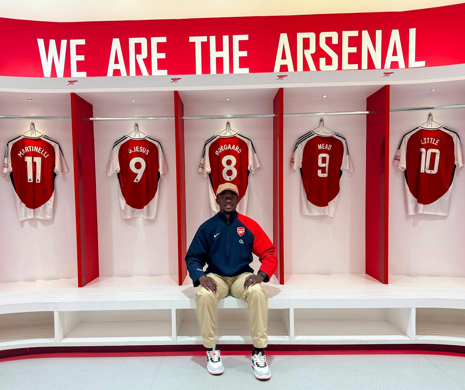 Arsenal locker room with team jerseys and club branding