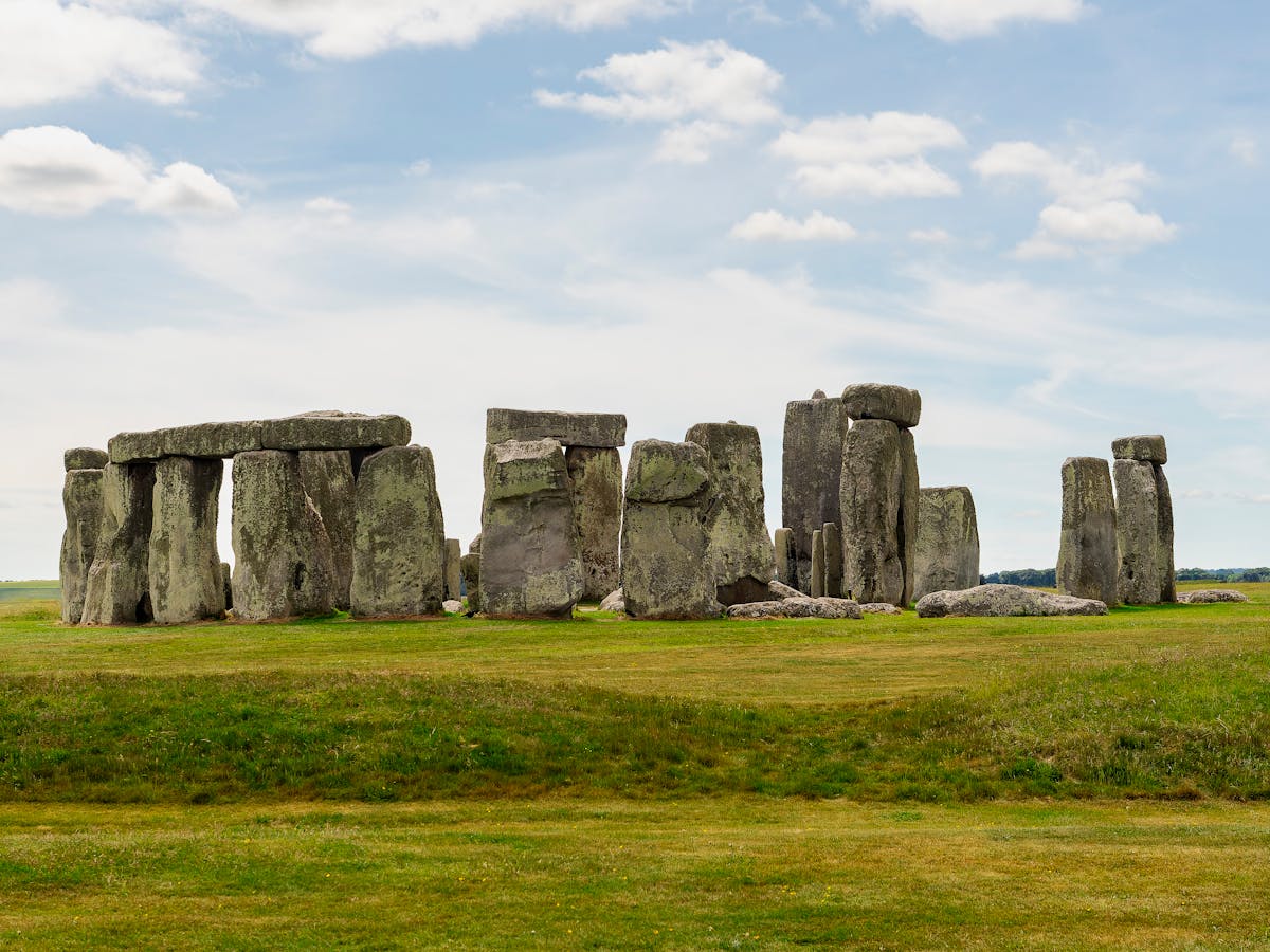 Stonehenge monument on a clear sunny day with green grass